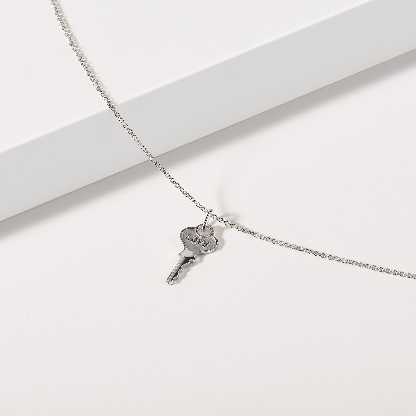 White Gold "love" Key Pendant | KLENOTA