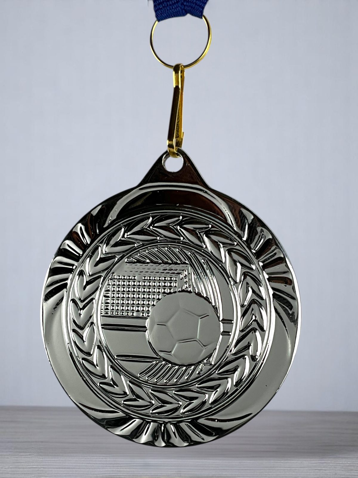 Champion Embossed Football Silver Medal | Trophy Monster